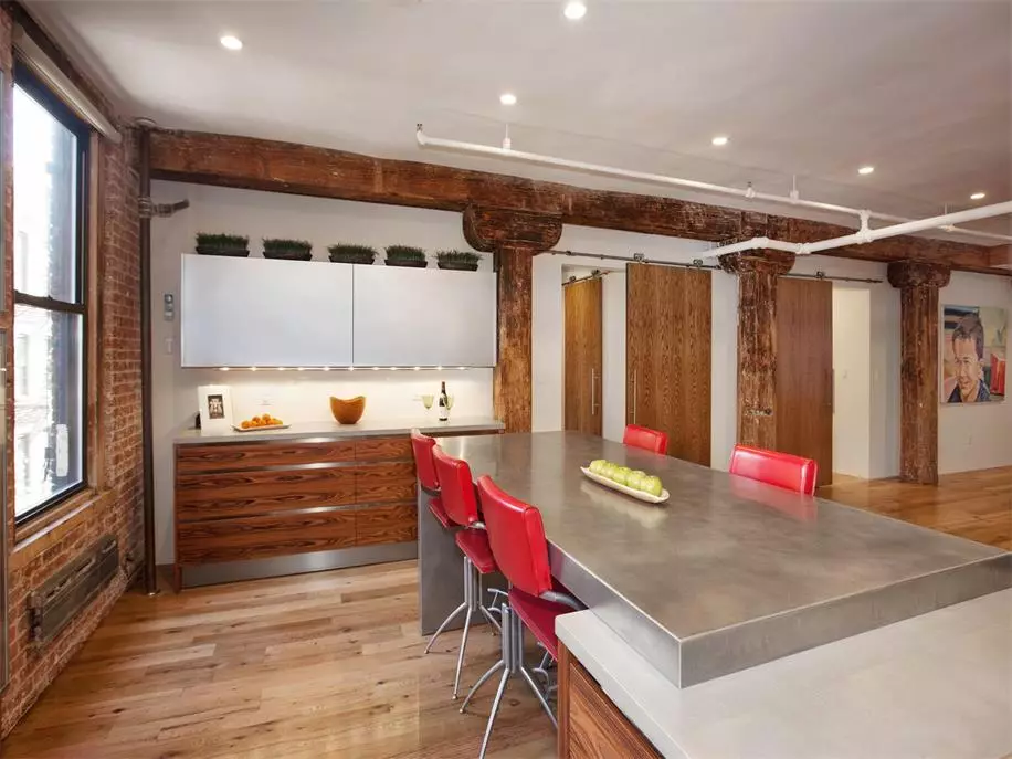 wood beam, hardwood floor, renovated chelsea loft, chef's kitchen, makabagong appliances